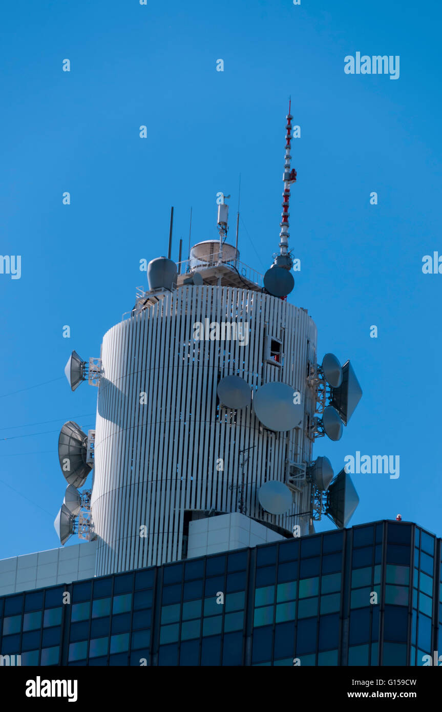 Telecommunication tower at the top of building Stock Photo - Alamy
