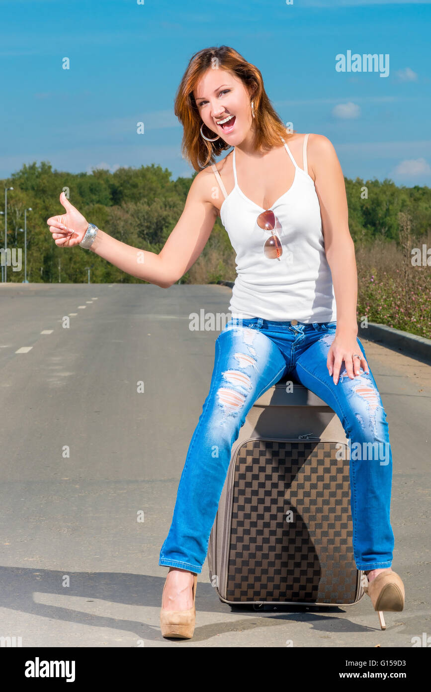 Car passing by woman hi-res stock photography and images - Alamy