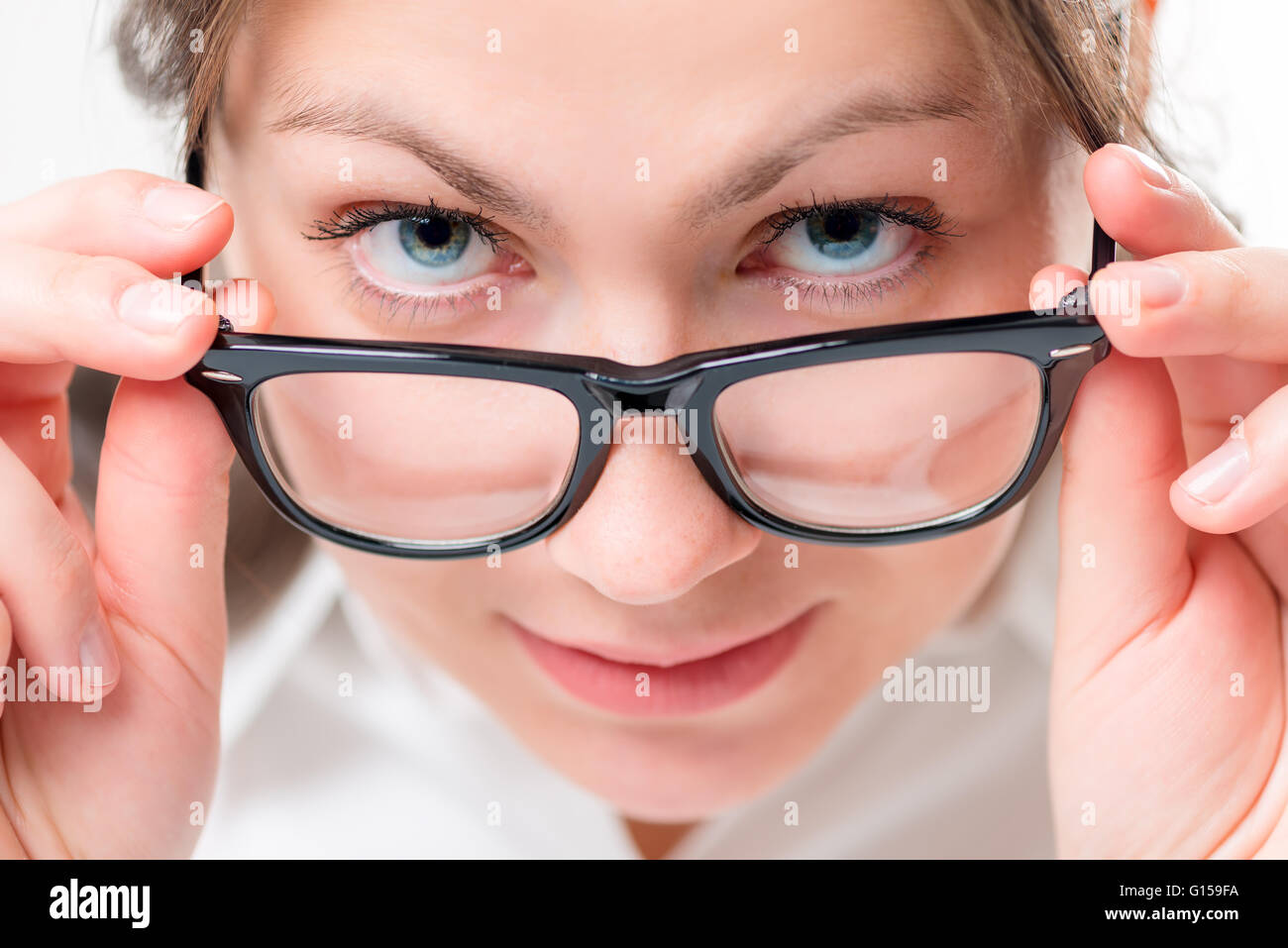 very attentive girl watching glasses having lowered Stock Photo - Alamy