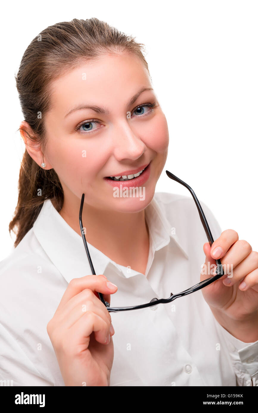 Portrait on white background of a beautiful woman putting on glasses ...