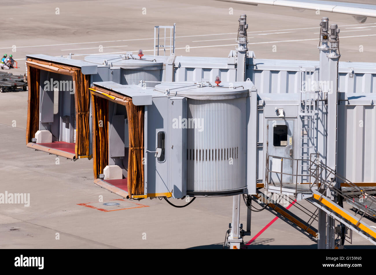 Jet bridges waiting for the airplane at airport Stock Photo - Alamy