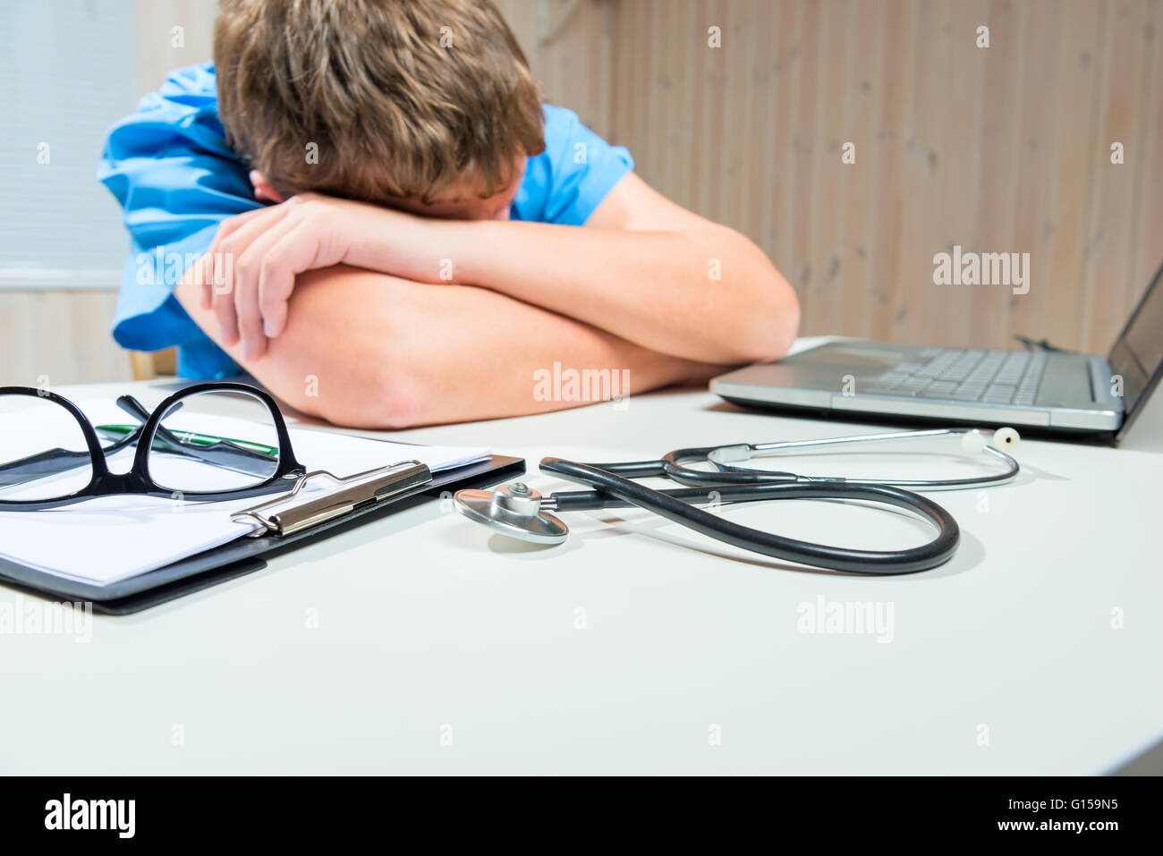 Tired doctor hi-res stock photography and images - Alamy