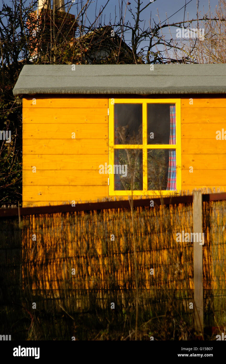 yellow garden shed Stock Photo - Alamy