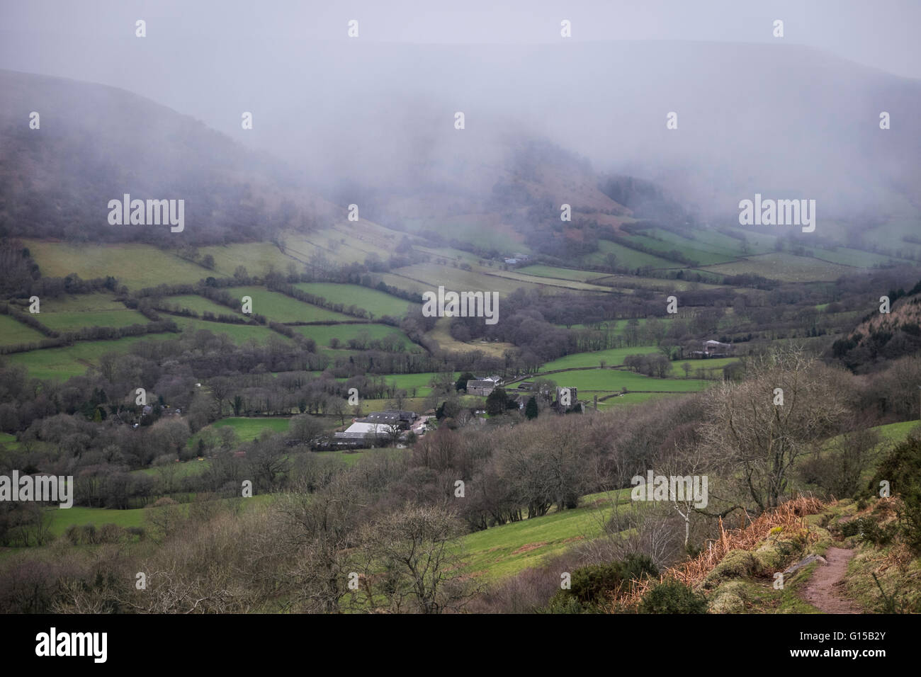 Snow storm descending onto llanthony Stock Photo - Alamy