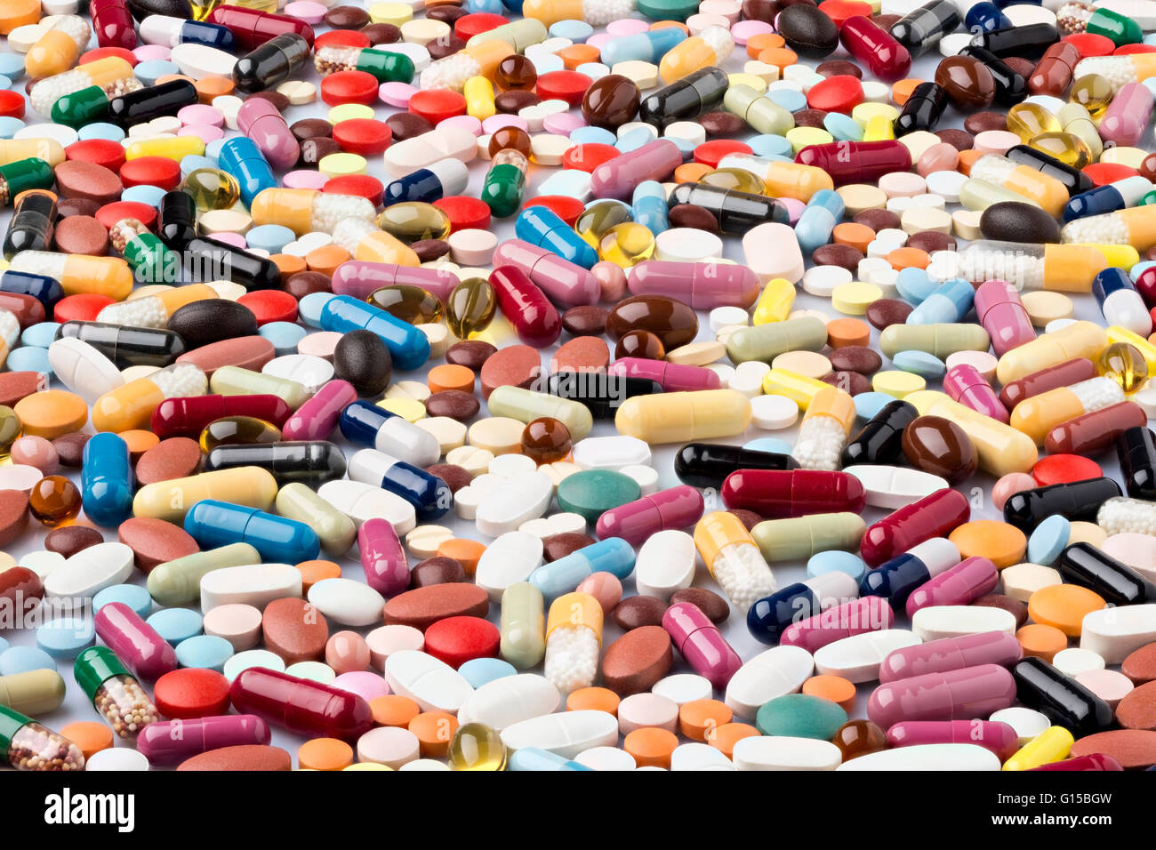 Scattered various colorful medical pills and drugs Stock Photo - Alamy