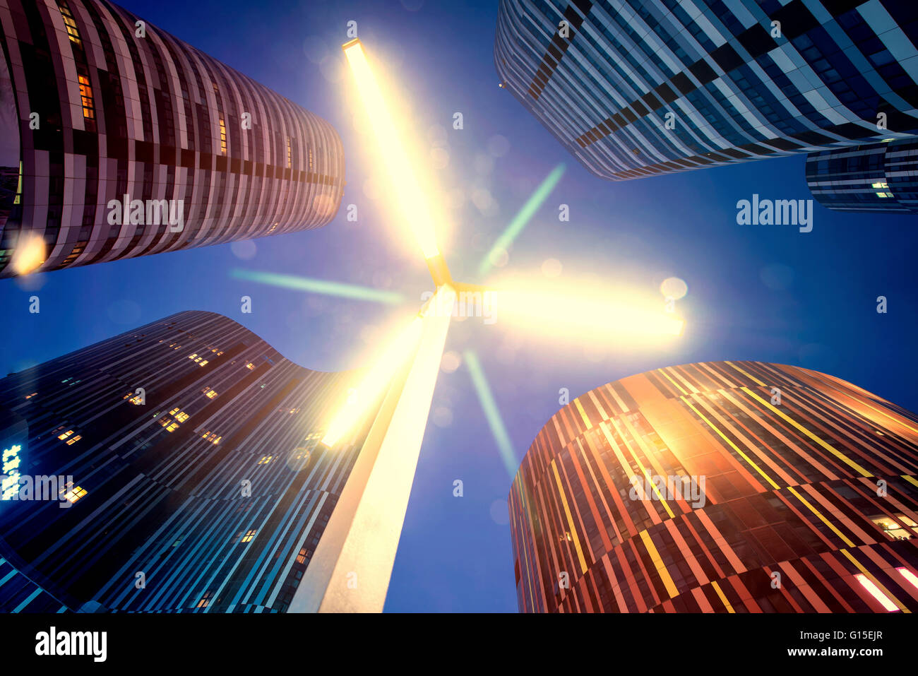 Low angle composition with LED lamp post and futuristic architecture at ...