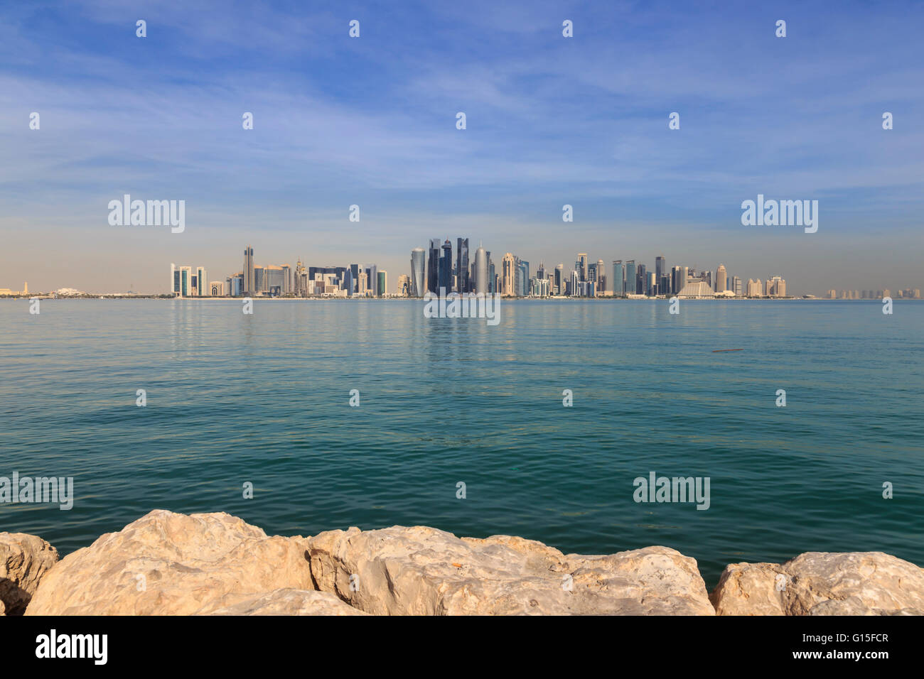 Modern city skyline of West Bay, across the calm turquoise waters of ...