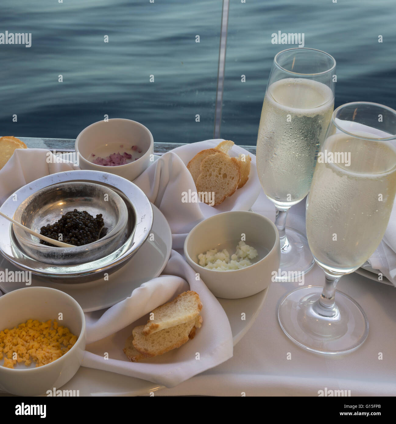 Chilled champagne and caviar with all the trimmings, al fresco on a ...