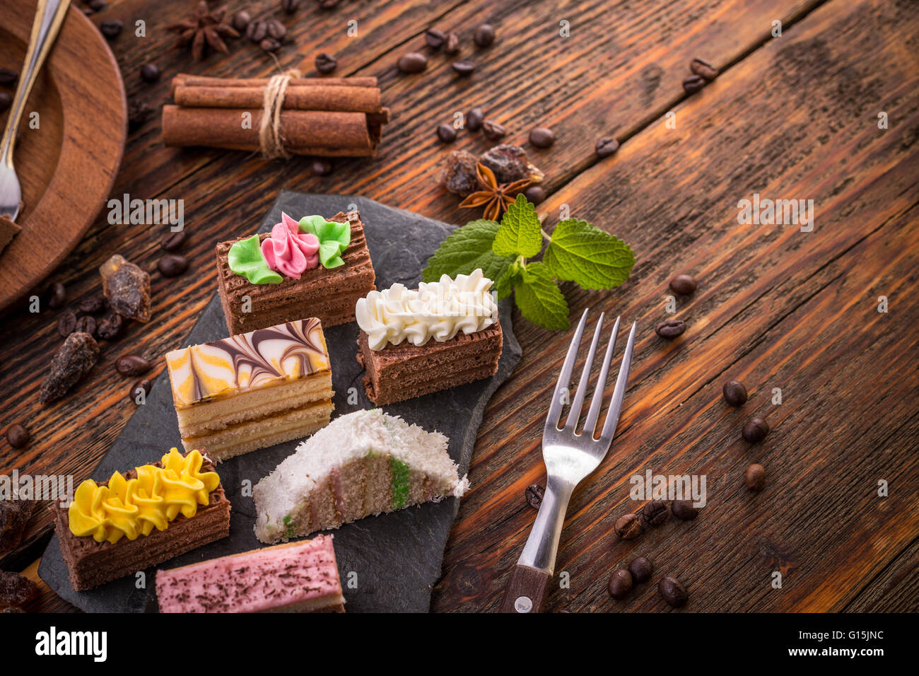 Assorted mini cakes with different cream Stock Photo - Alamy