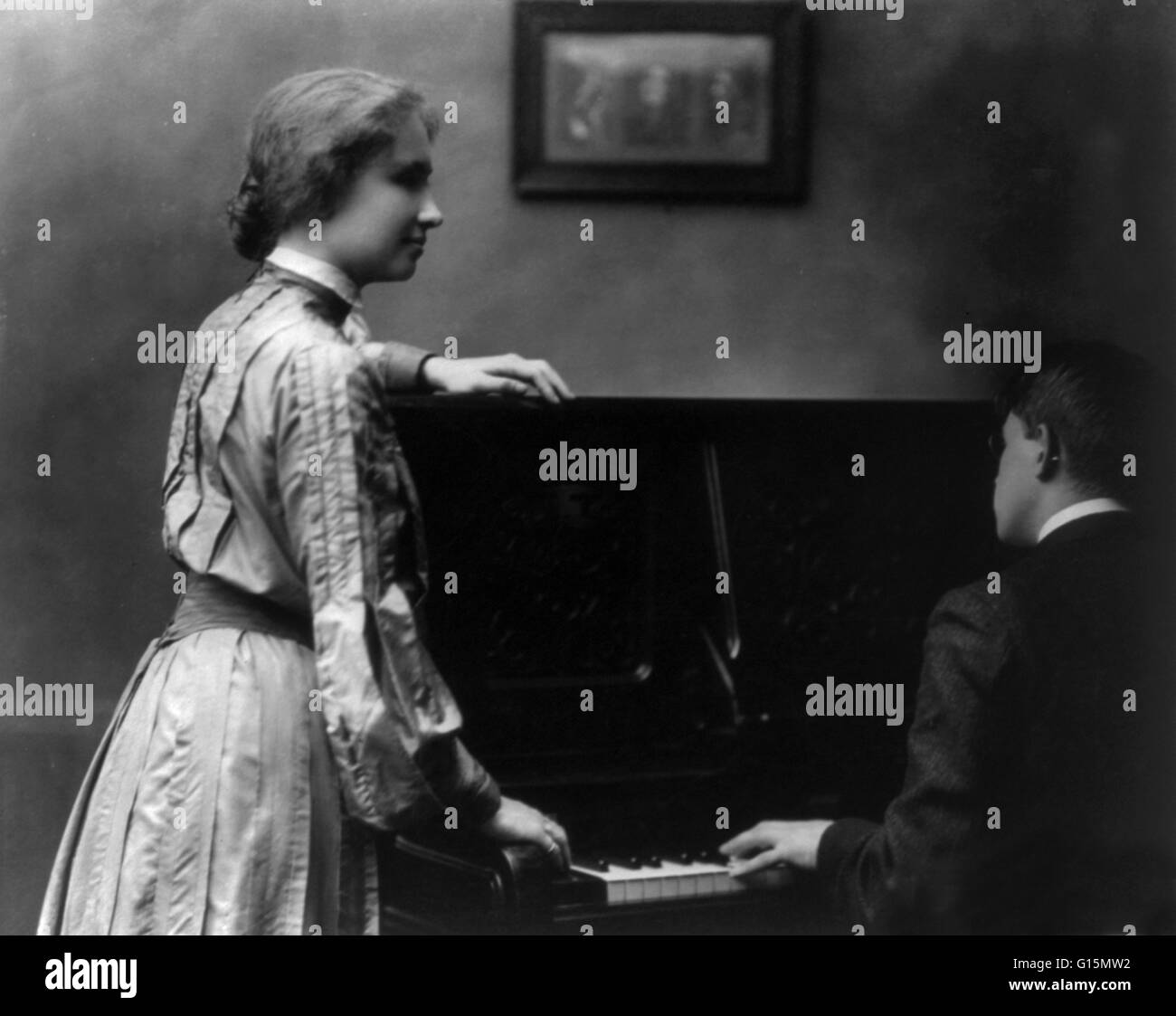 Keller standing at piano, which man is playing, circa 1904. Helen Adams Keller (June 27, 1880 ...