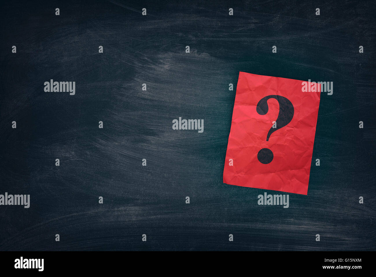 Red paper note with question marks on black board. Close up Stock Photo ...