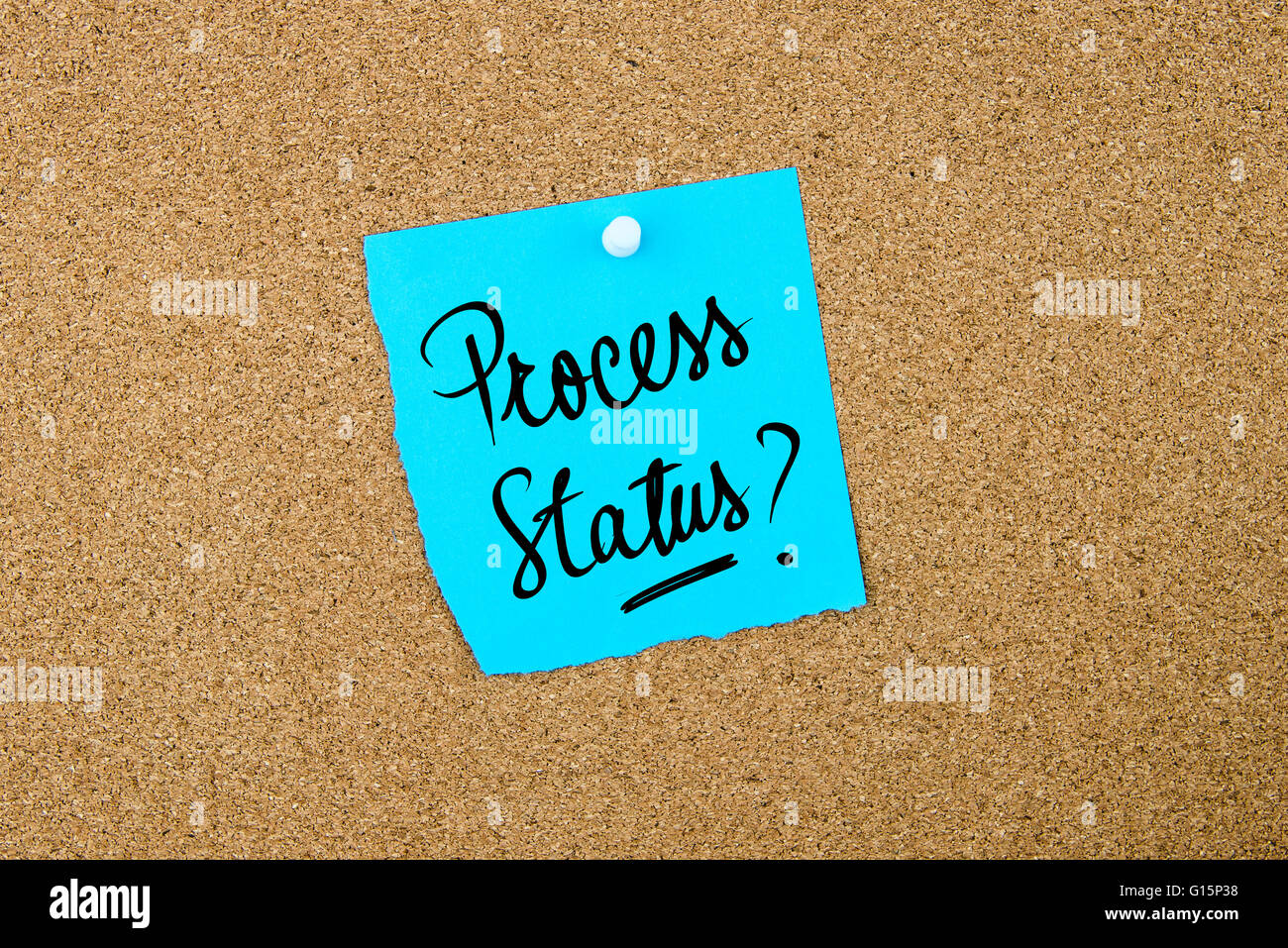 Process Status ? written on blue paper note pinned on cork board with ...