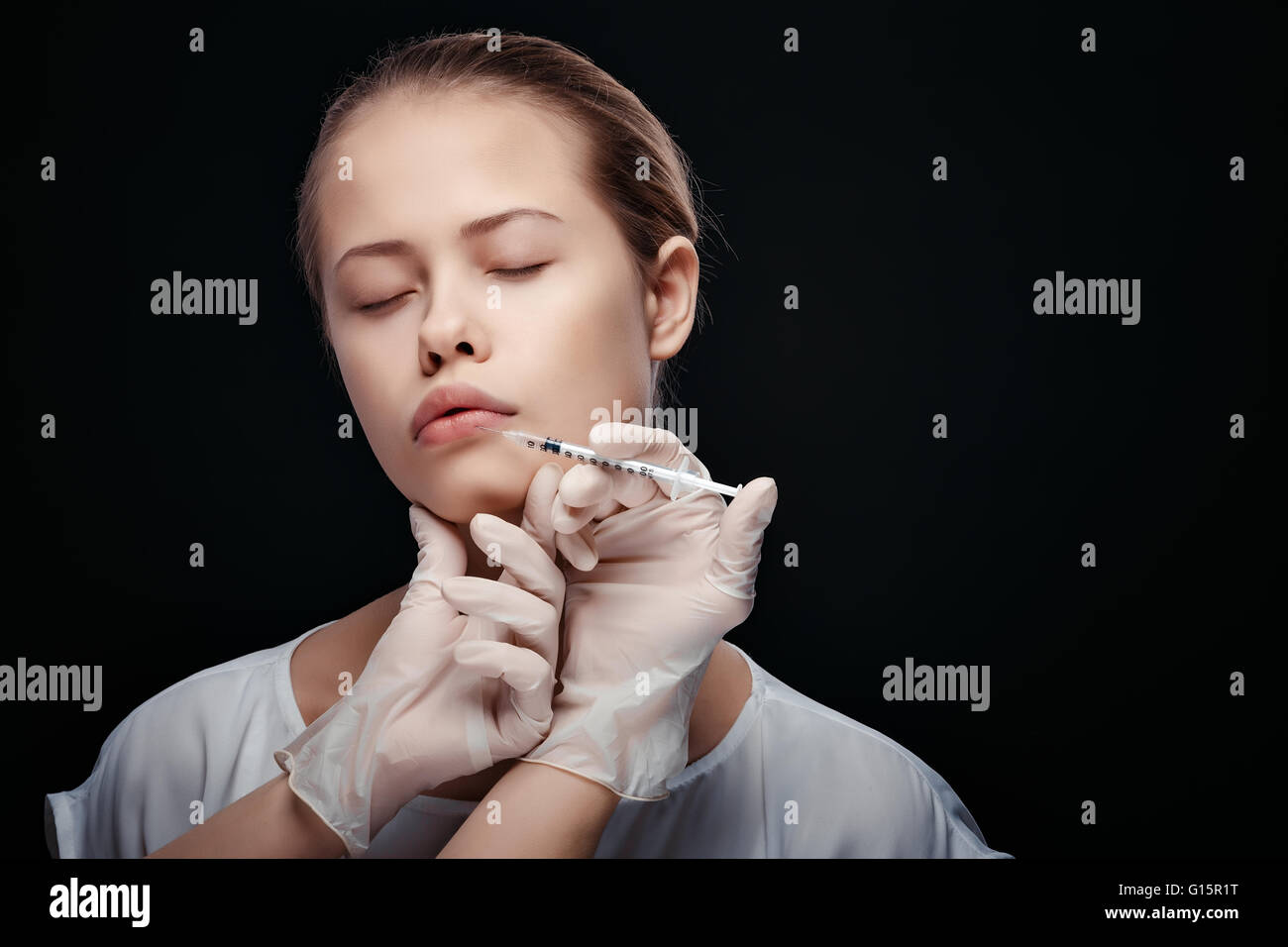 Portrait of young Caucasian woman getting cosmetic injection Stock ...