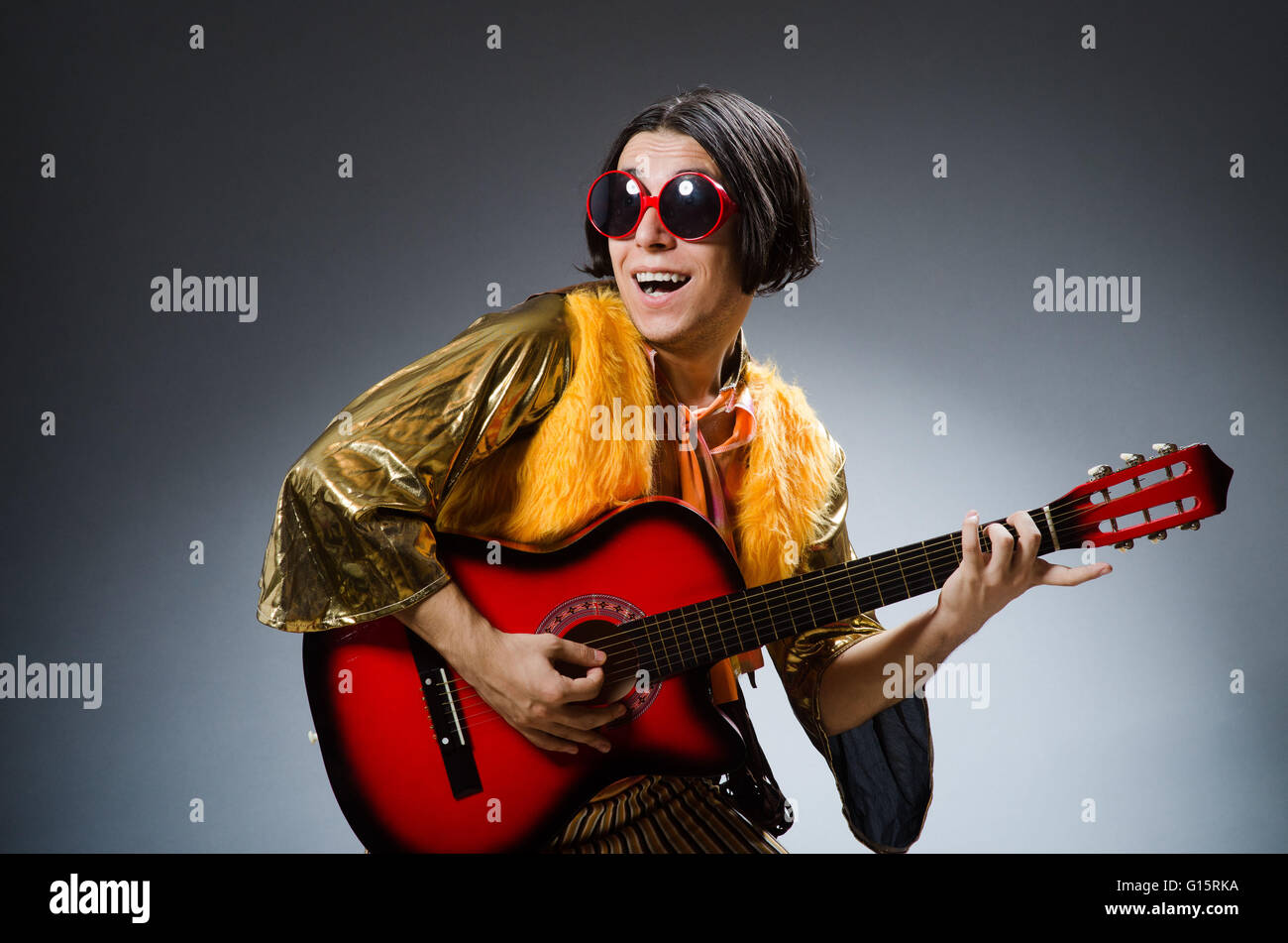 Man with guitar in musical concept Stock Photo - Alamy