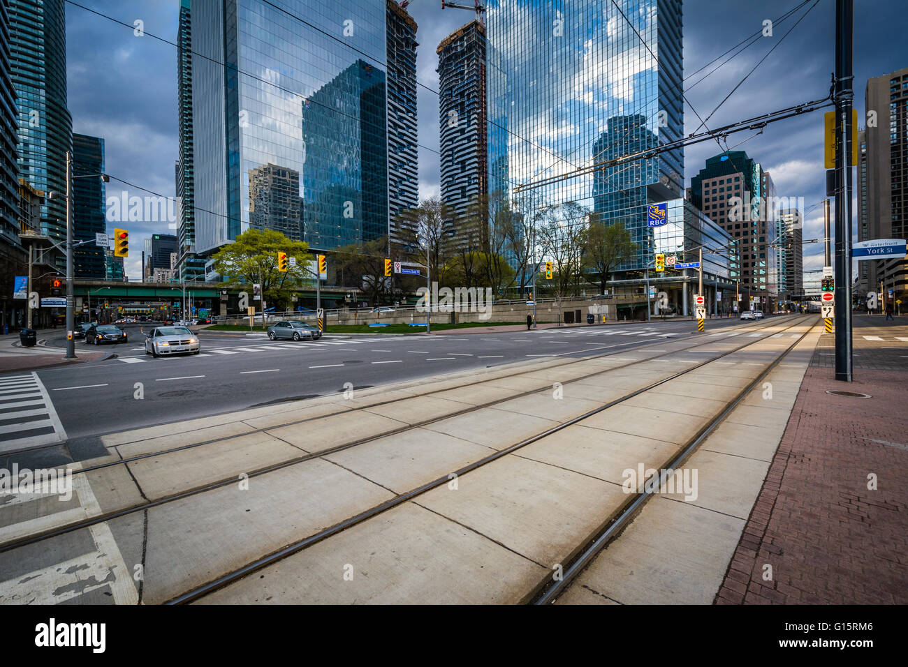 Streetcar tracks and modern buildings along Queens Quay West, at the ...