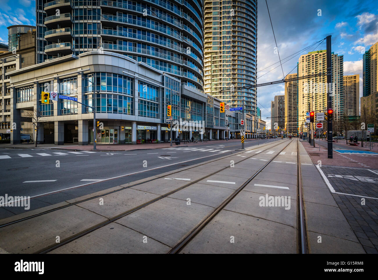 Streetcar tracks and modern buildings along Queens Quay West, at the ...