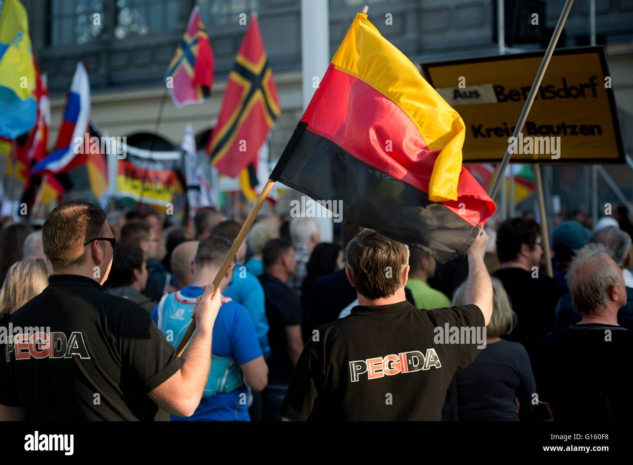 Dresden, Germany. 09th May, 2016. Participants hold flags during a ...