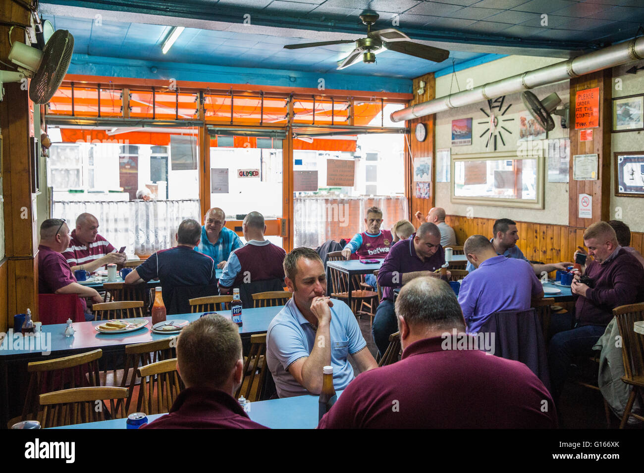 London, UK. 10th May, 2016. West Ham fans eat breakfast in Ken's Cafe ...