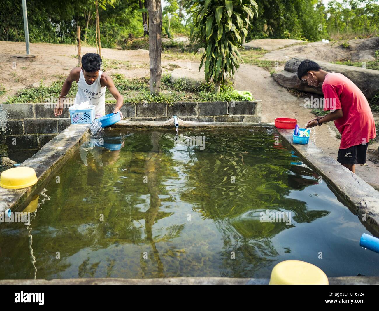 May 10, 2016 - Men bathe at the cistern people use for bathing at the ...