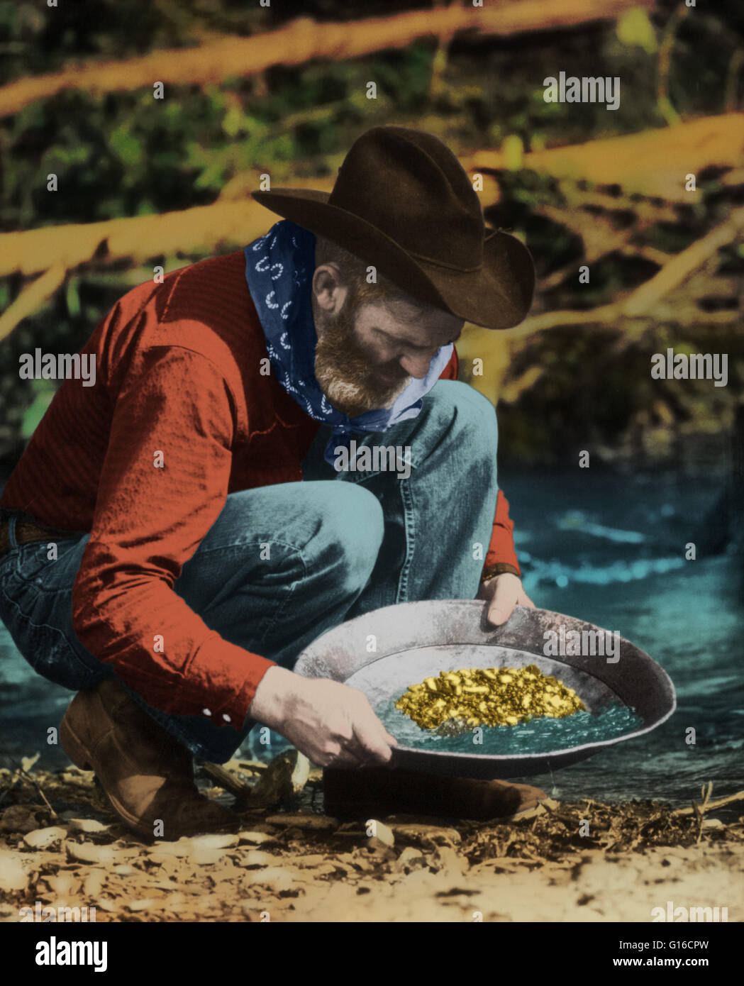 Color-enhanced image of a prospector panning for gold in the Black ...