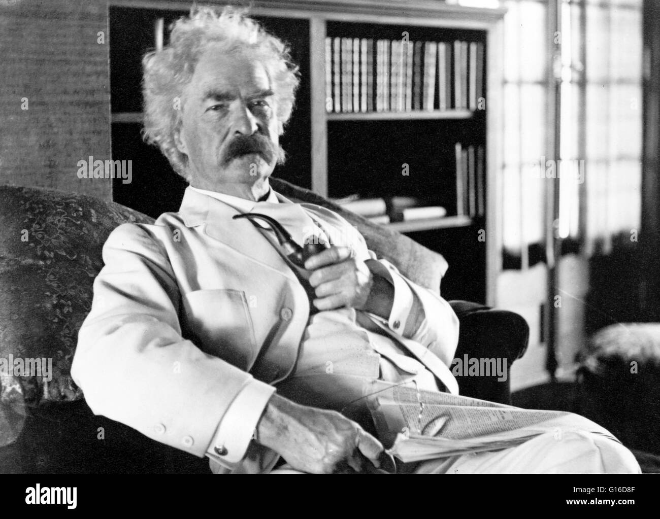 Samuel Langhorne Clemens, more popularly known as Mark Twain, seated ...