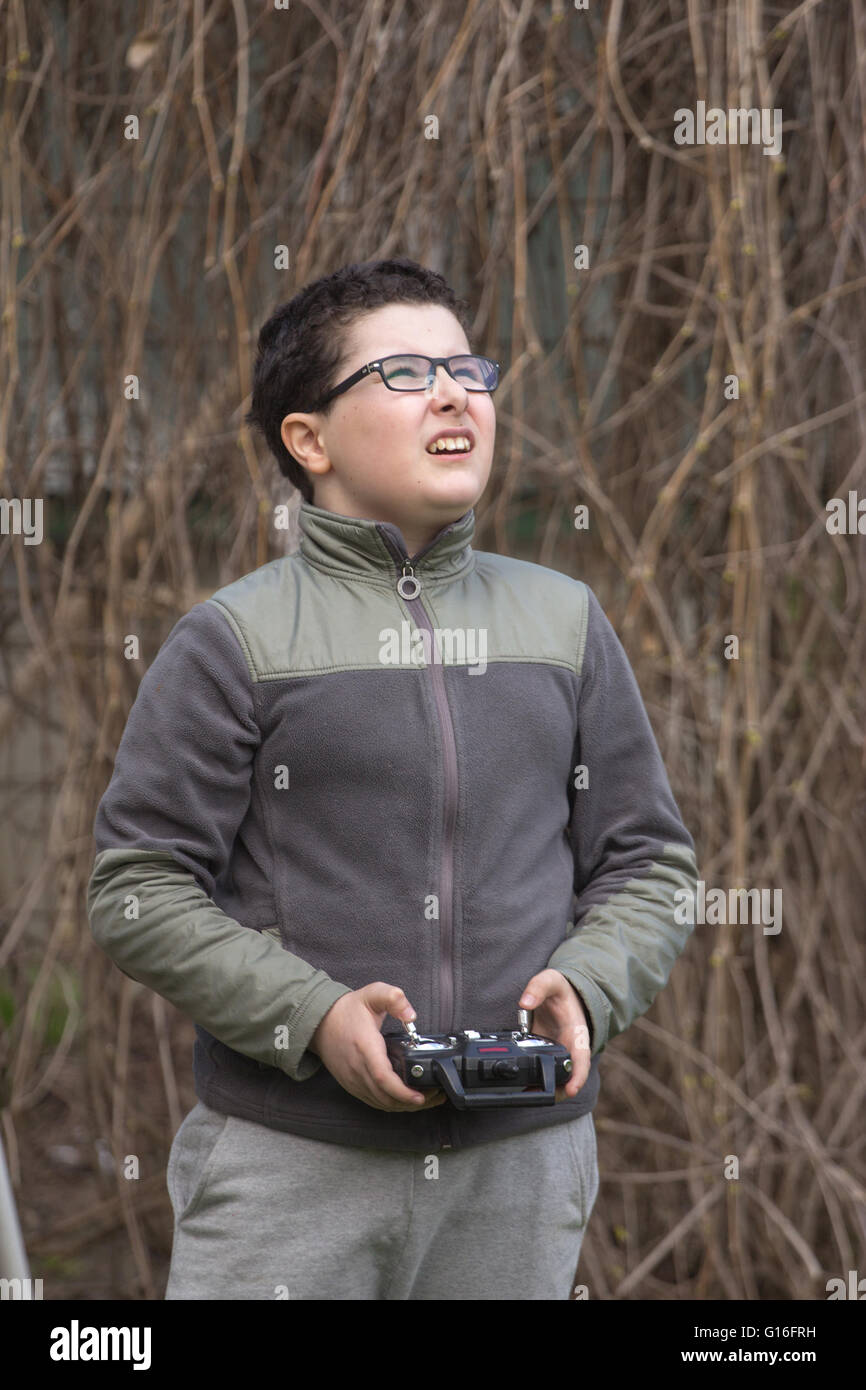 Young boy with remote control playong outdoors Stock Photo - Alamy