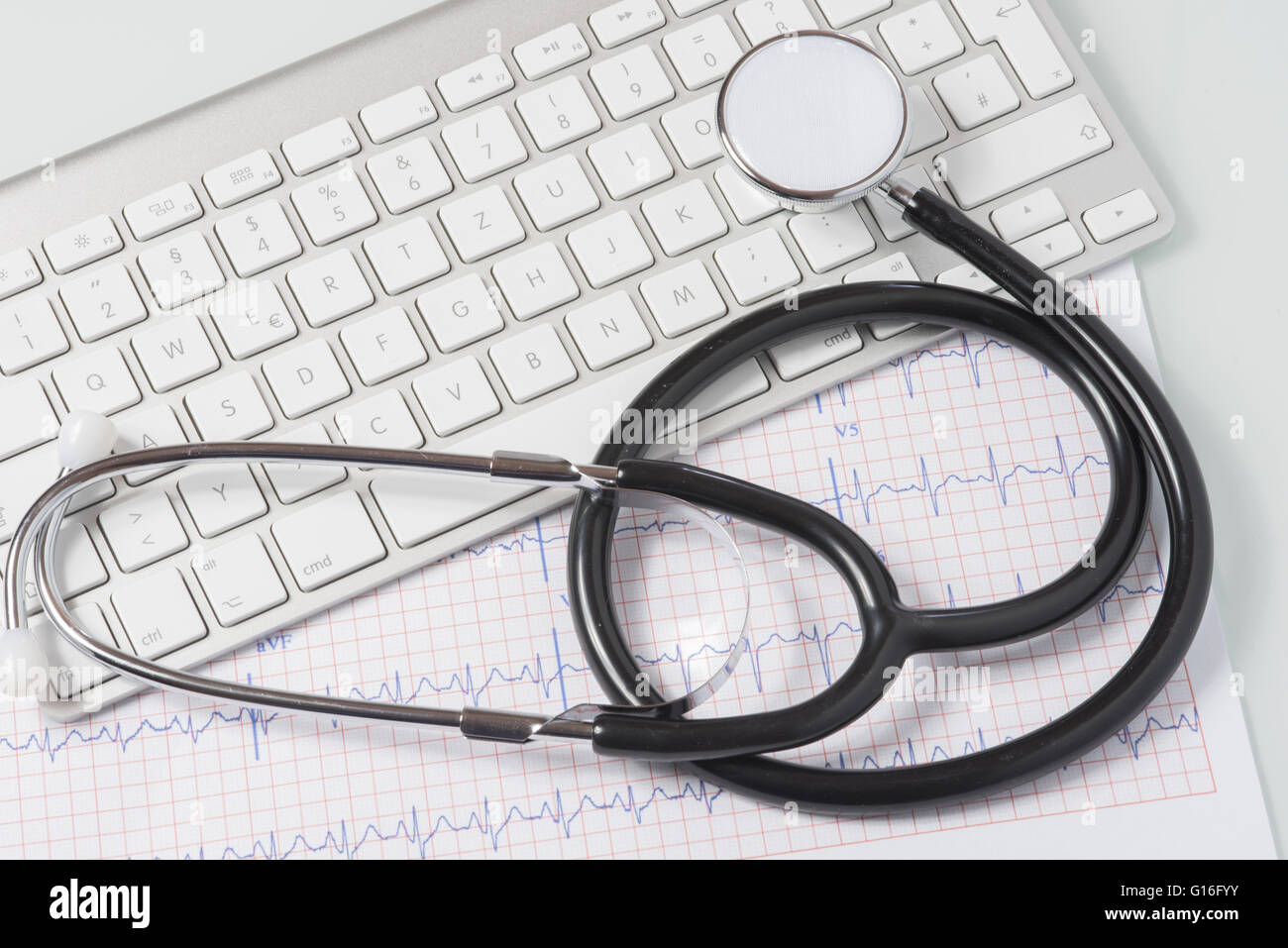 stethoscope, ecg and keyboard on doctor's desk Stock Photo - Alamy
