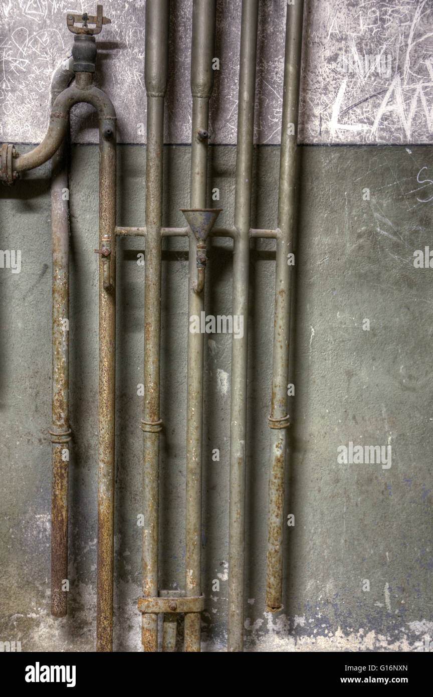 Old rusty pipes on the wall Stock Photo - Alamy