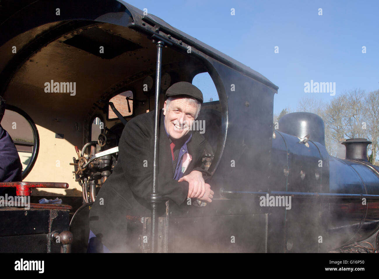 A smiling steam engine driver waiting for the 'right away' at Bishops ...