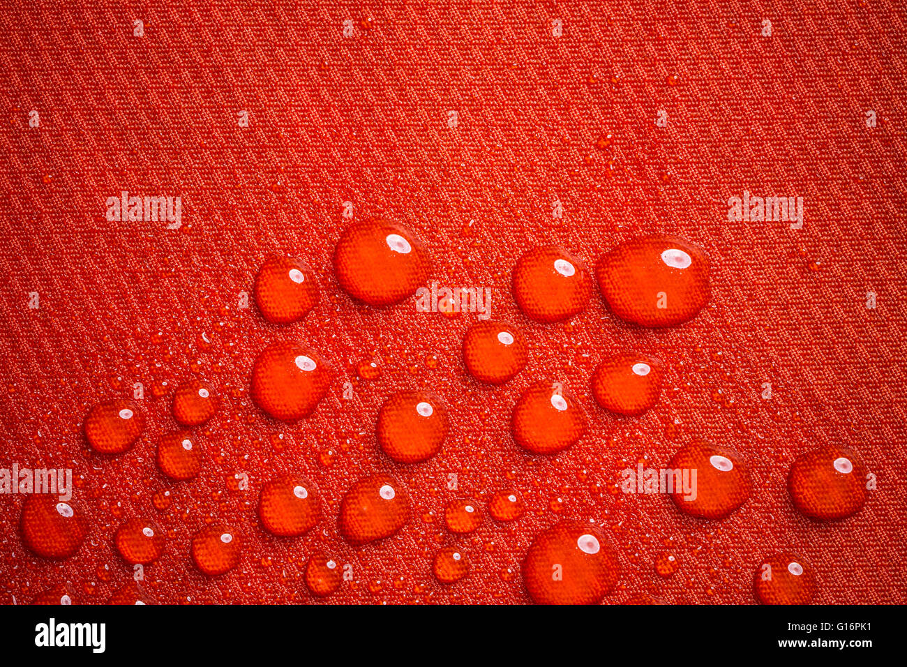 Water drops on red textile Stock Photo - Alamy