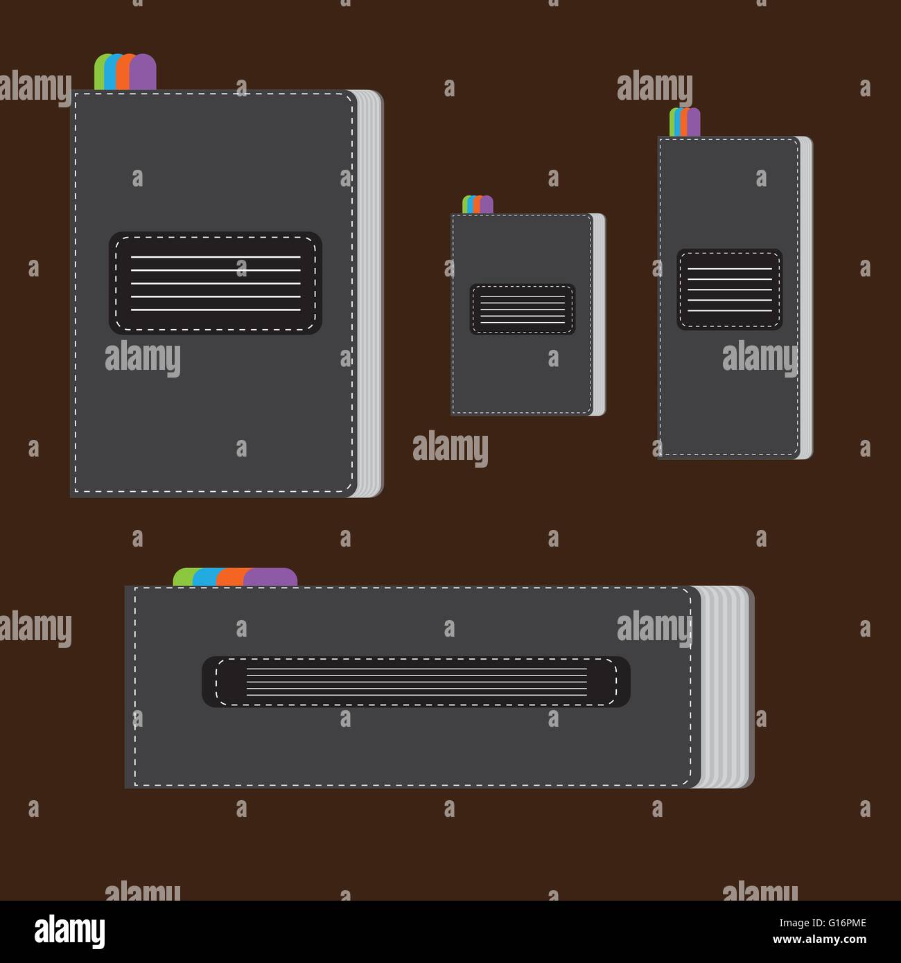 A set of silver writing notebooks of different size with colored marks ...