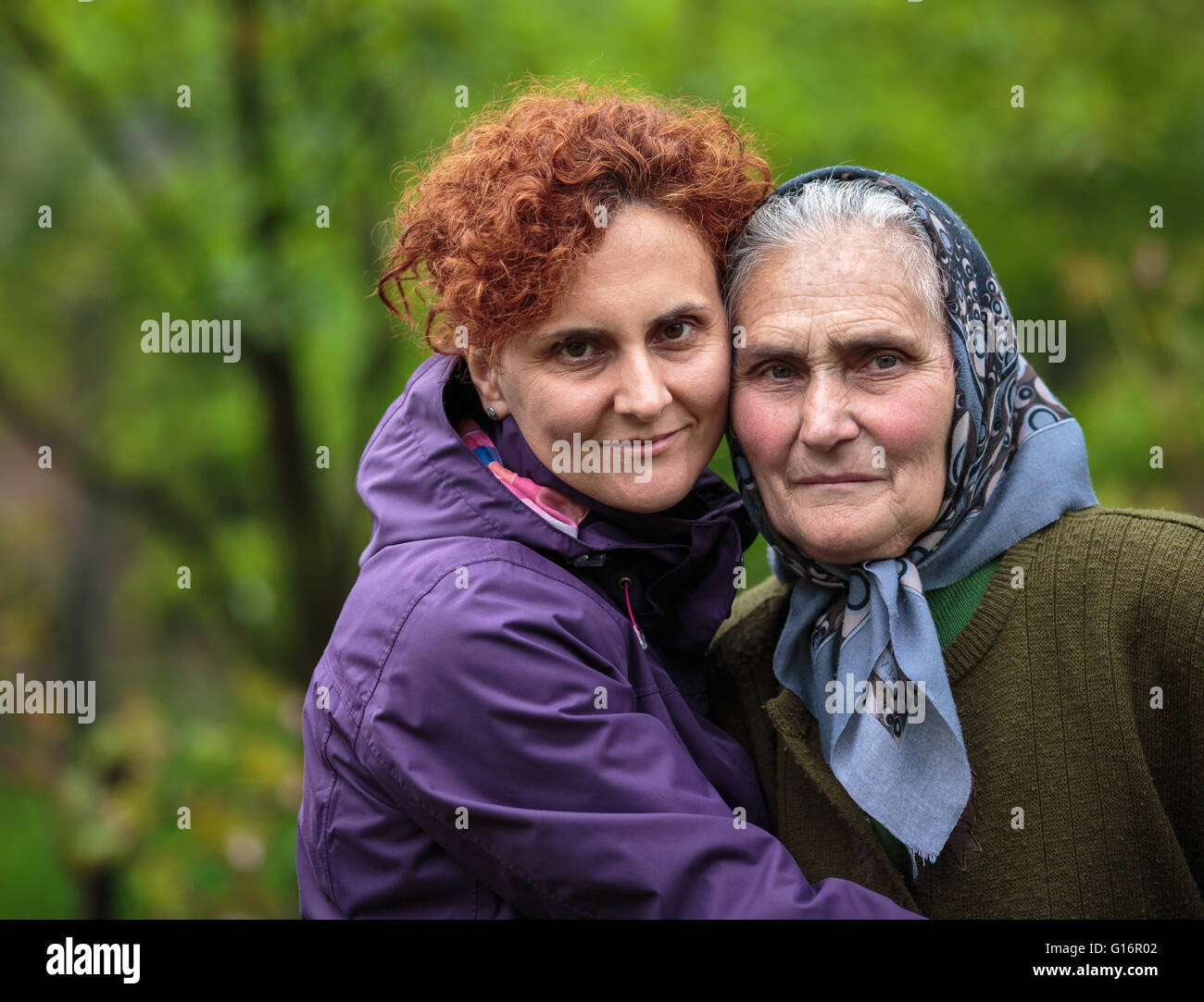 Farmer mother and daughter outdoor, closeup portrait Stock Photo - Alamy