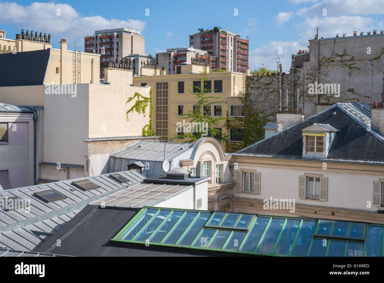 Cluster of rooftops with glass skylights and food gardens looking ...