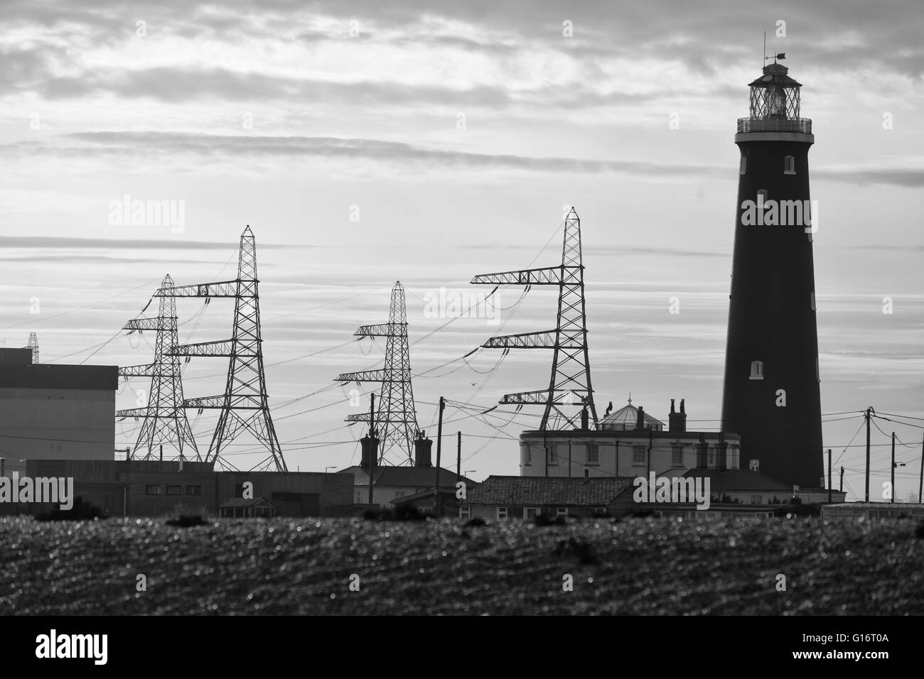 Dungeness Lighthouse with electricity pylons and power station Stock ...