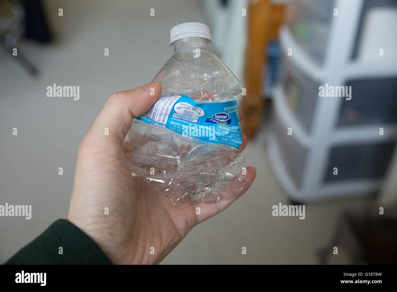 Crumpled Plastic Bottle squeezed water bottle Stock Photo - Alamy