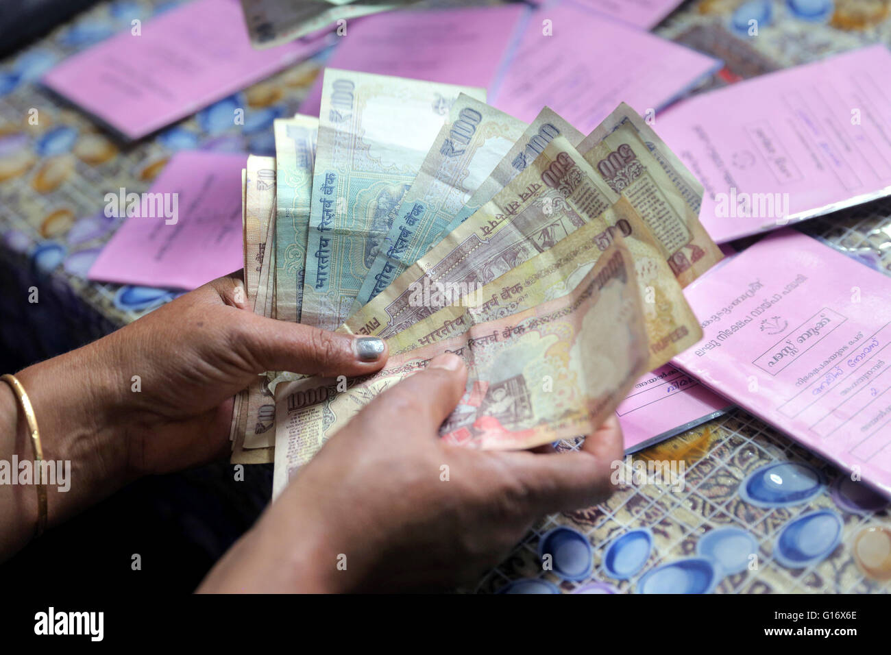 Indian Rupees and saving books of a micro finance loan-self-help group ...