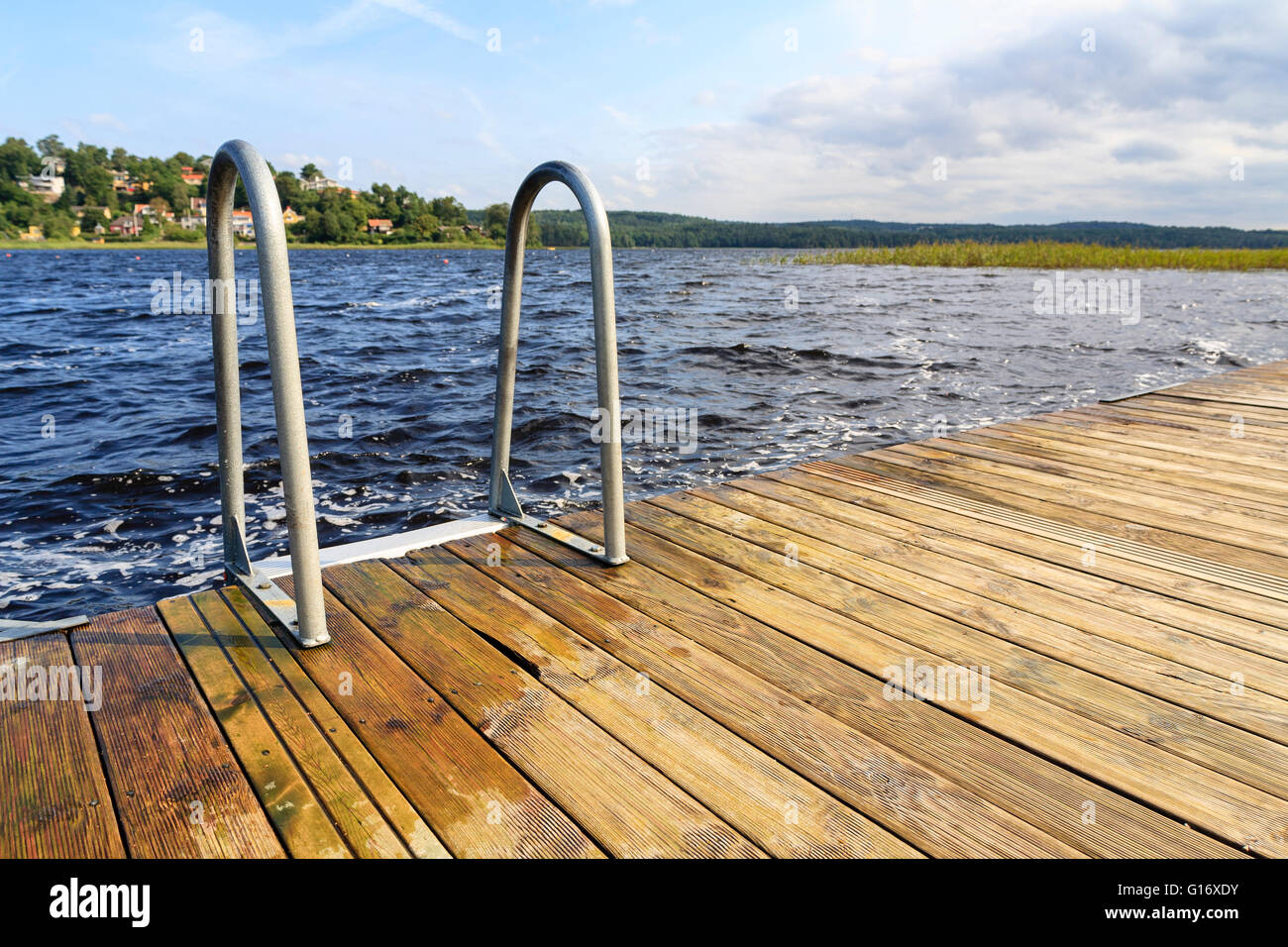 Empty jetty and jetty ladder at lake Rådasjön, Västra Götaland, Sweden ...
