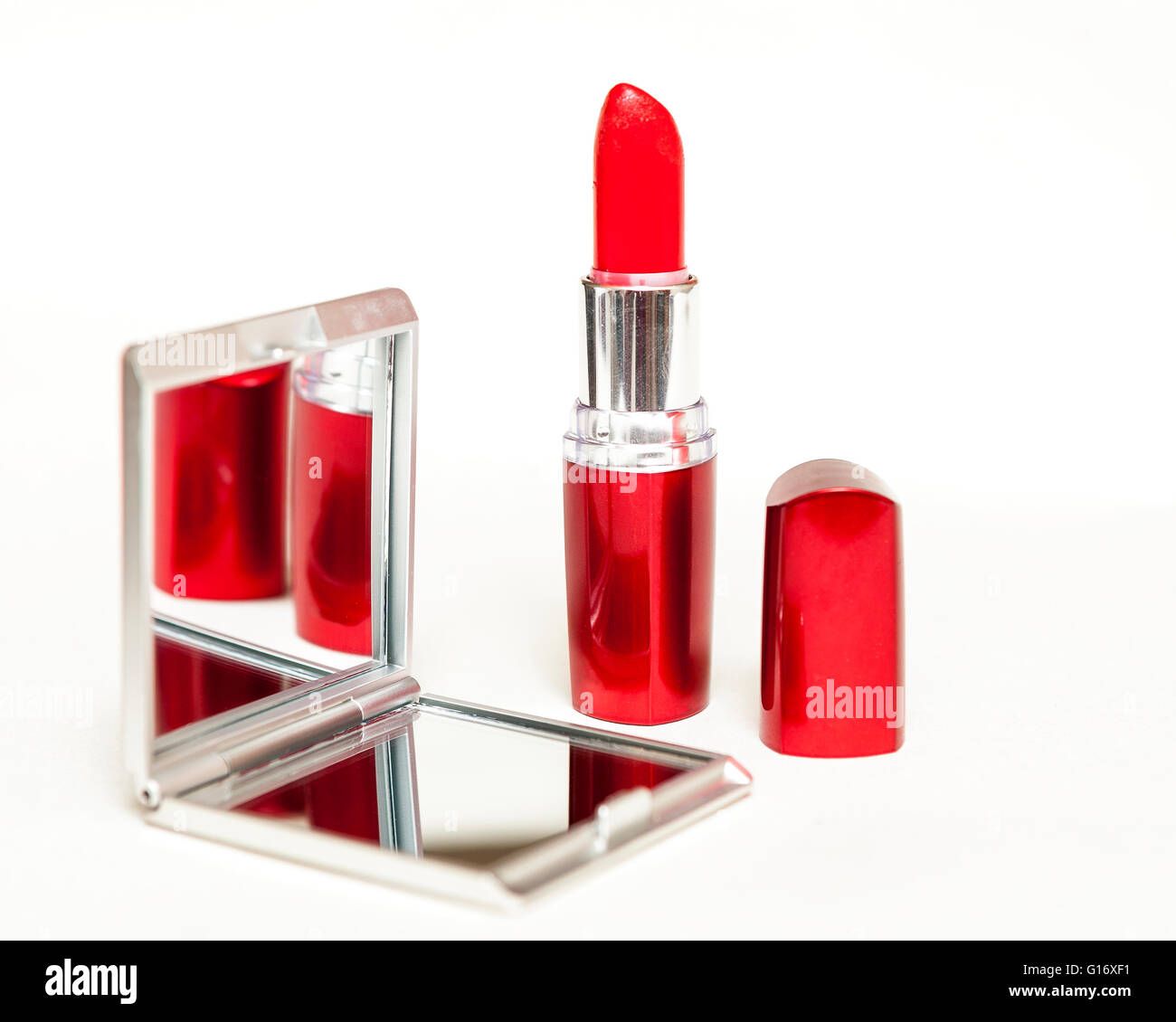 Bright red lipstick reflected in compact make up mirror Model Release ...