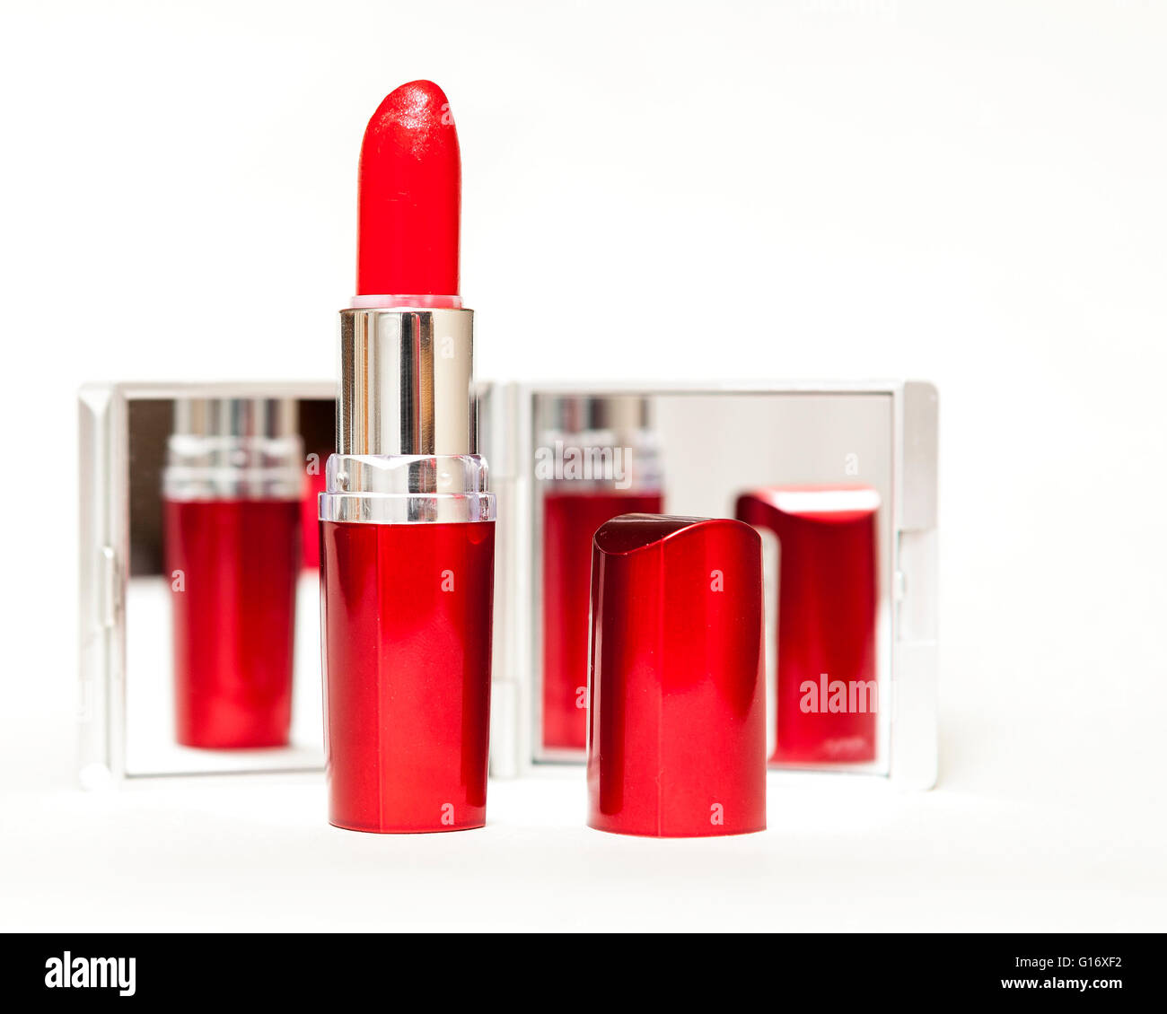 Bright red lipstick reflected in compact make up mirror Model Release ...