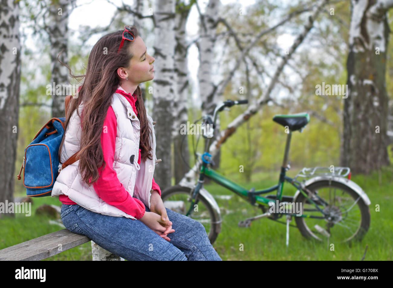 Girl sitting on bike in hi-res stock photography and images - Alamy