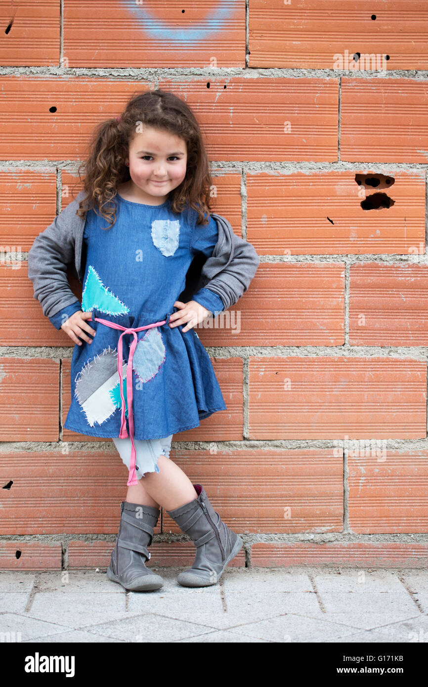 Smiling cute girl dress like a homeless with dirty face Stock Photo - Alamy