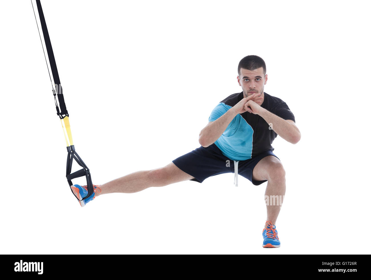 Athletic trainer on functional loops for training isolated on white ...