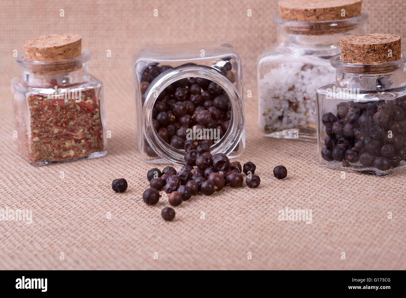 photo showing juniper in glass containers Stock Photo - Alamy