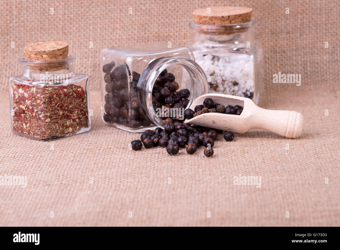 photo showing juniper in measuring containers with a wooden scoop Stock ...