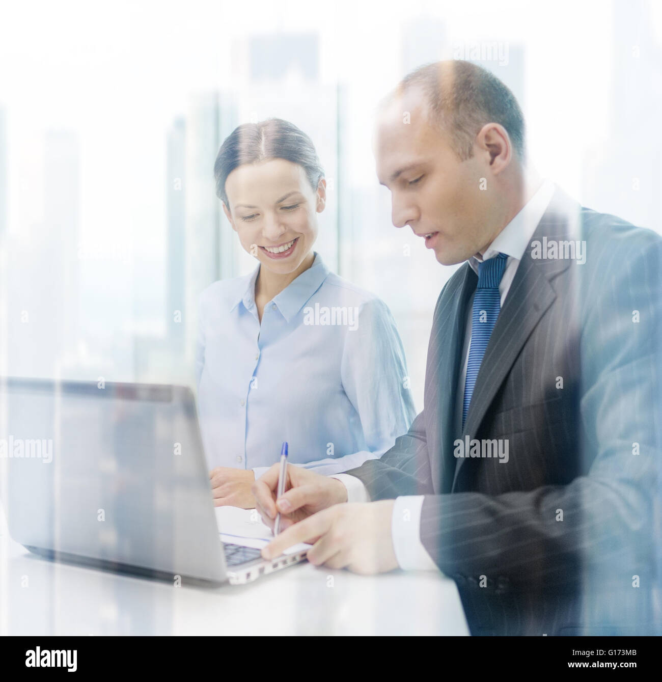Two businessmen discussing laptop hi-res stock photography and images ...