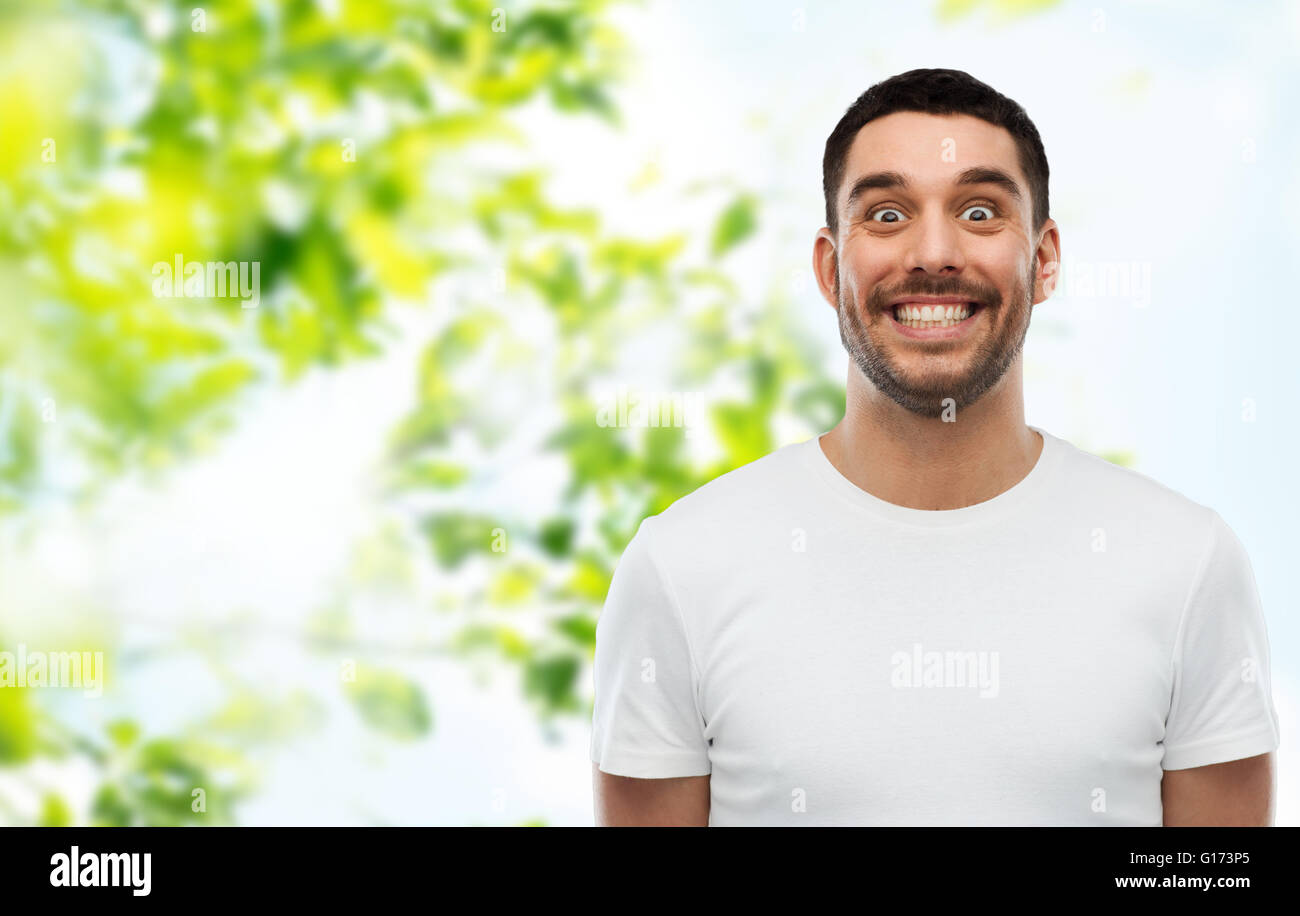 man with funny face over green natural background Stock Photo - Alamy