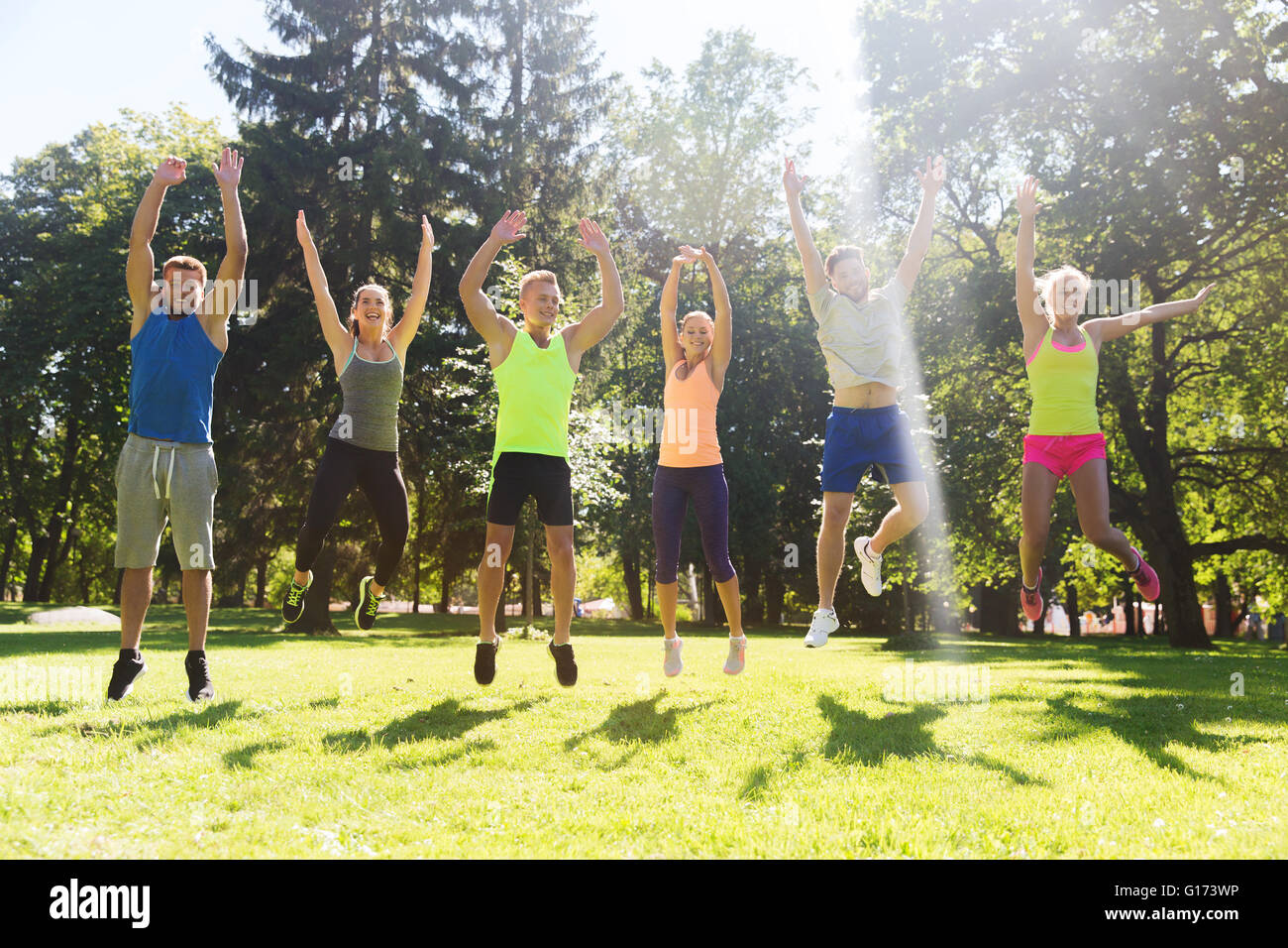group of happy friends jumping high outdoors Stock Photo - Alamy