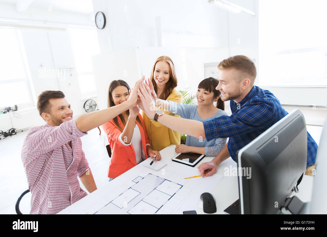 creative team making high five at office Stock Photo - Alamy