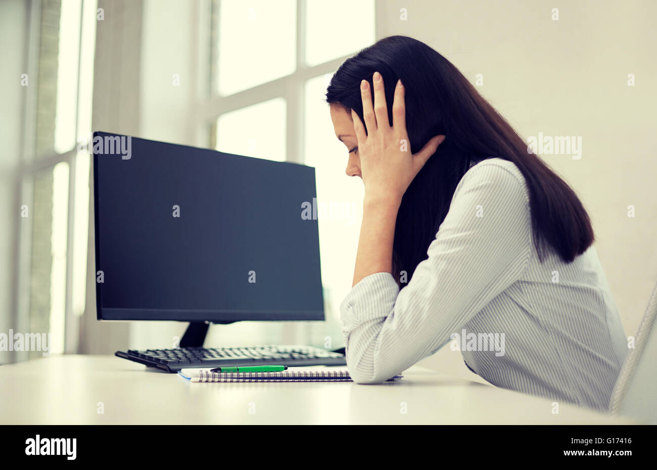 close up of sad woman with computer and notebook Stock Photo - Alamy