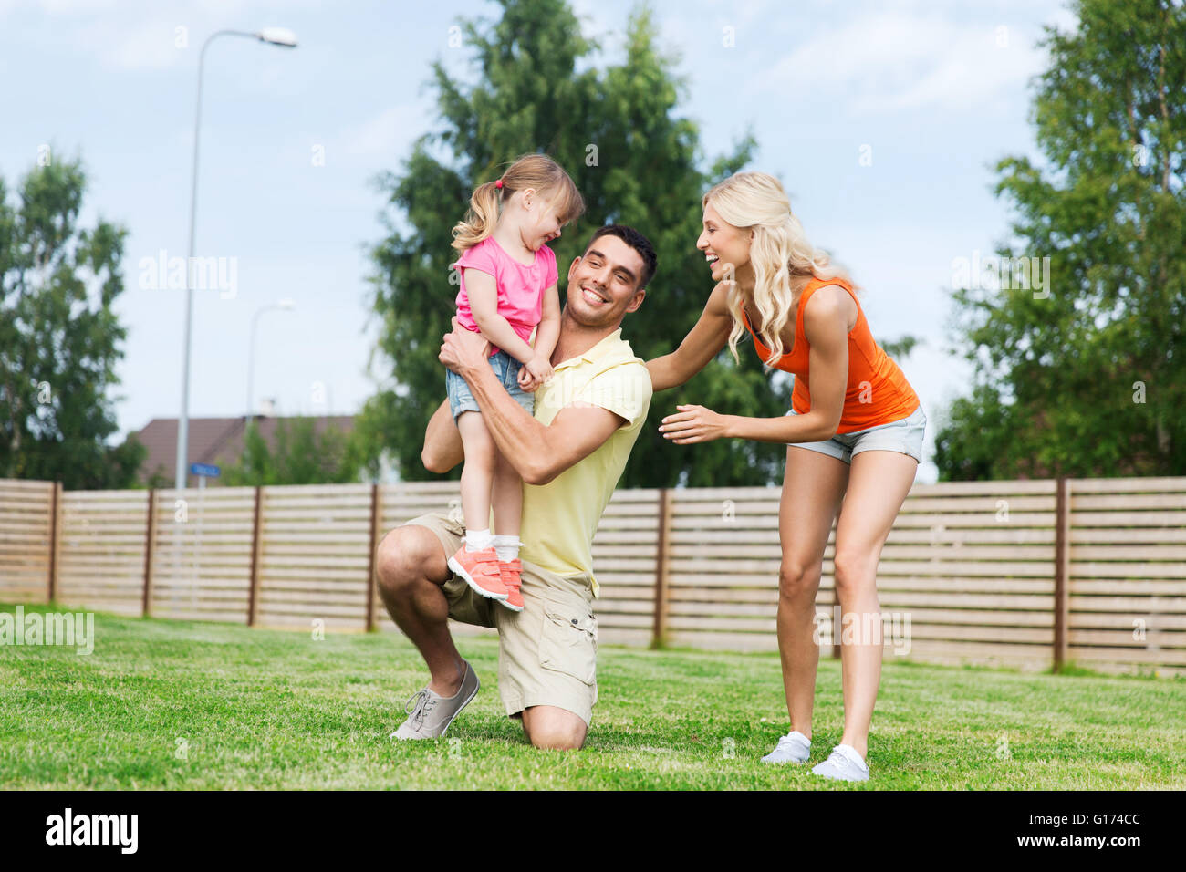 happy family hugging outdoors Stock Photo - Alamy